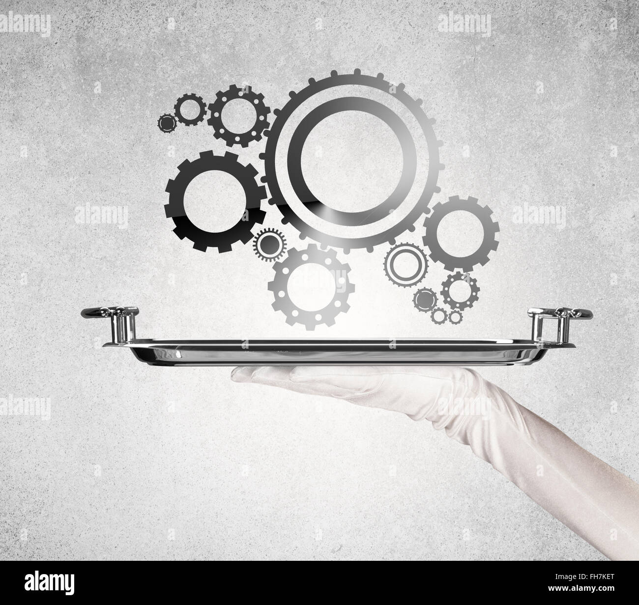 Working cog wheel concept on tray Stock Photo - Alamy