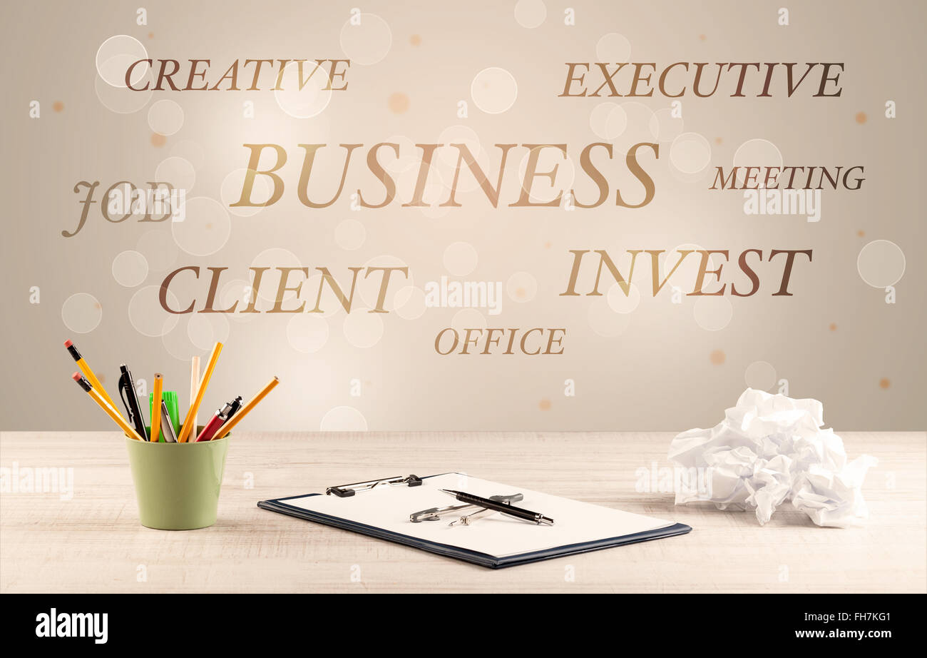 Business office desk with writing on wall Stock Photo - Alamy