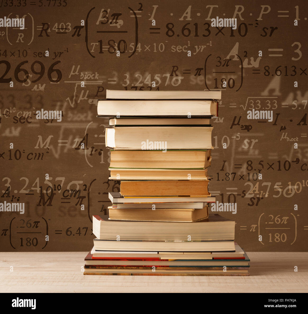 Books on vintage background with math formulas Stock Photo - Alamy