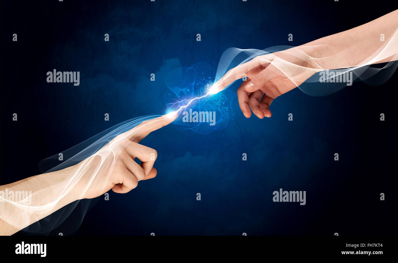 Hands connecting through fingers in space Stock Photo - Alamy