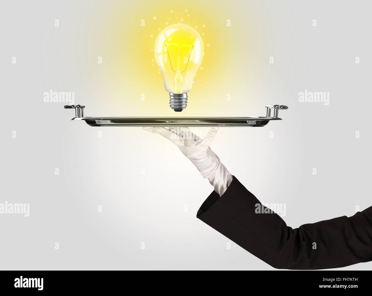 Clever idea concept with bulb on tray Stock Photo - Alamy