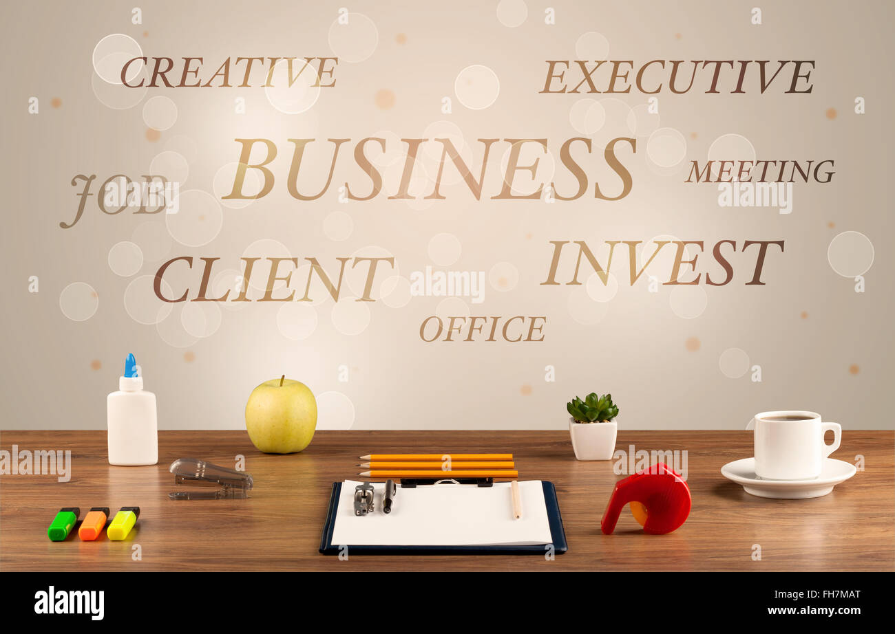 Business office desk with writing on wall Stock Photo - Alamy