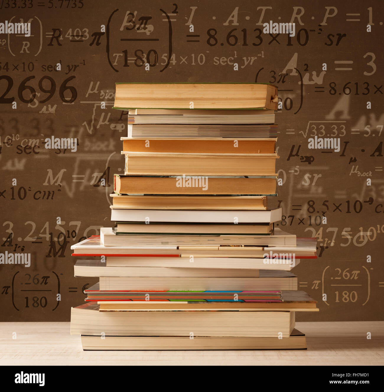 Books on vintage background with math formulas Stock Photo - Alamy