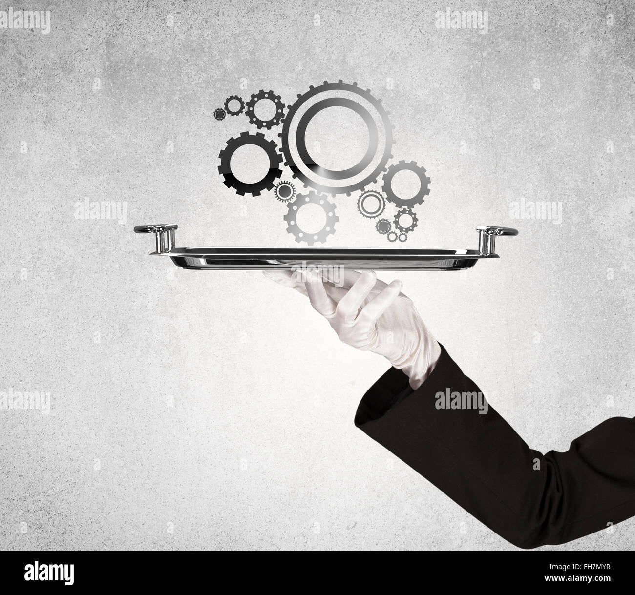 Working cog wheel concept on tray Stock Photo - Alamy