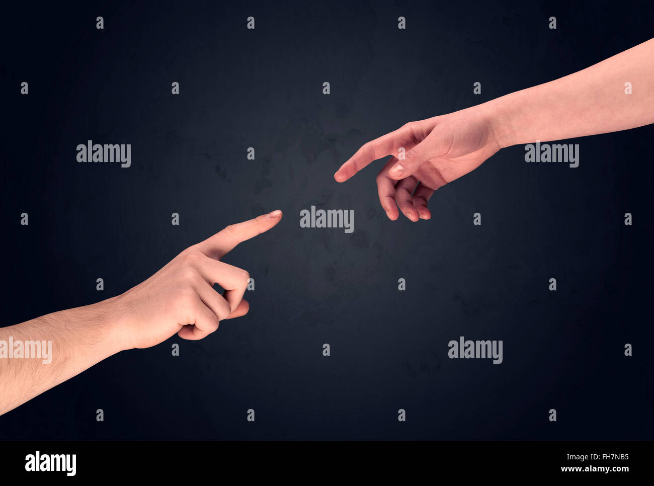 Hand about to touch another one Stock Photo - Alamy