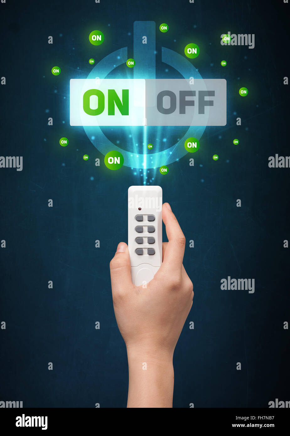 Hand with remote control and on-off signals Stock Photo - Alamy