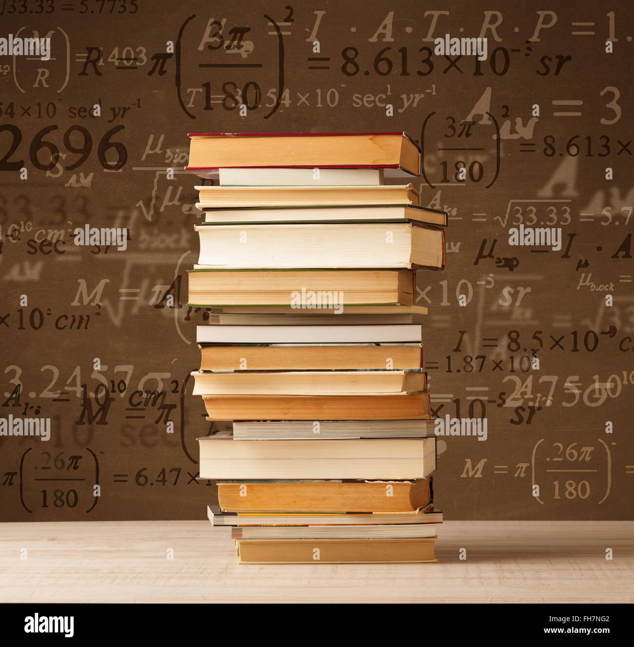 Books on vintage background with math formulas Stock Photo - Alamy