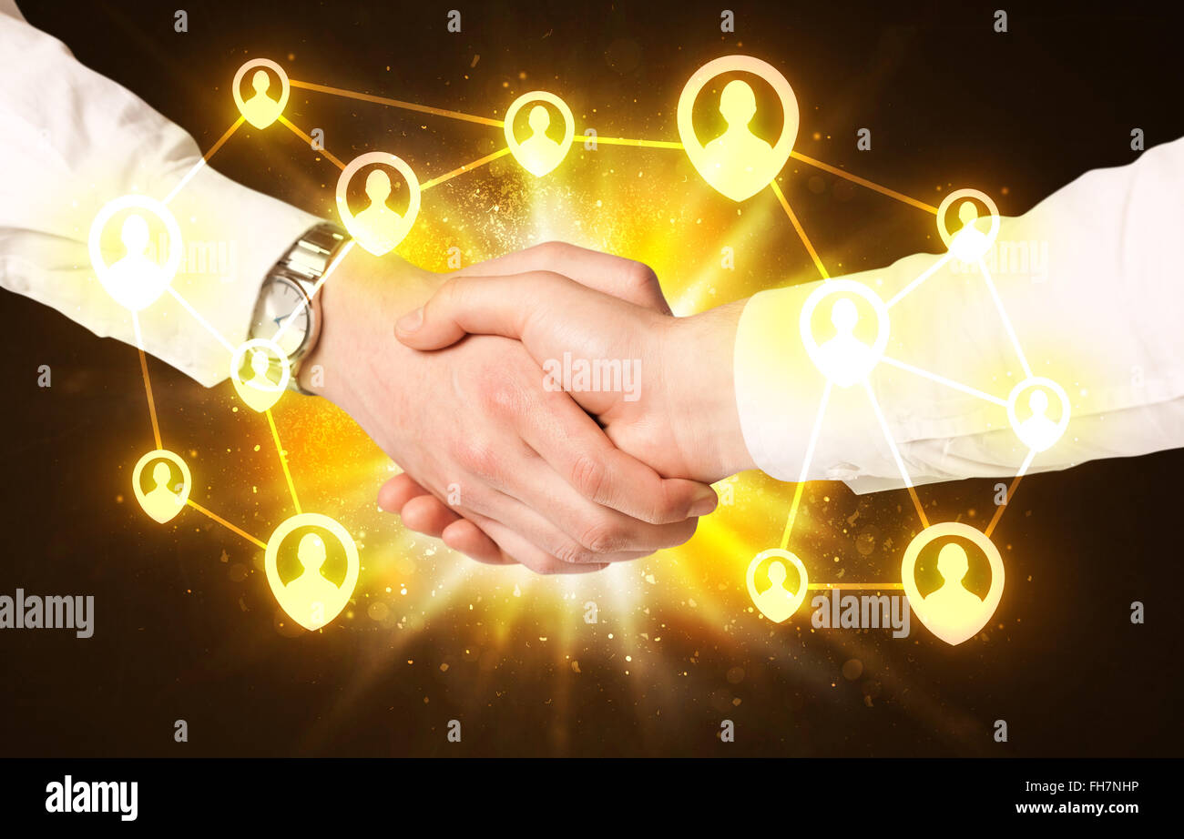 Social netwok connection handshake Stock Photo - Alamy