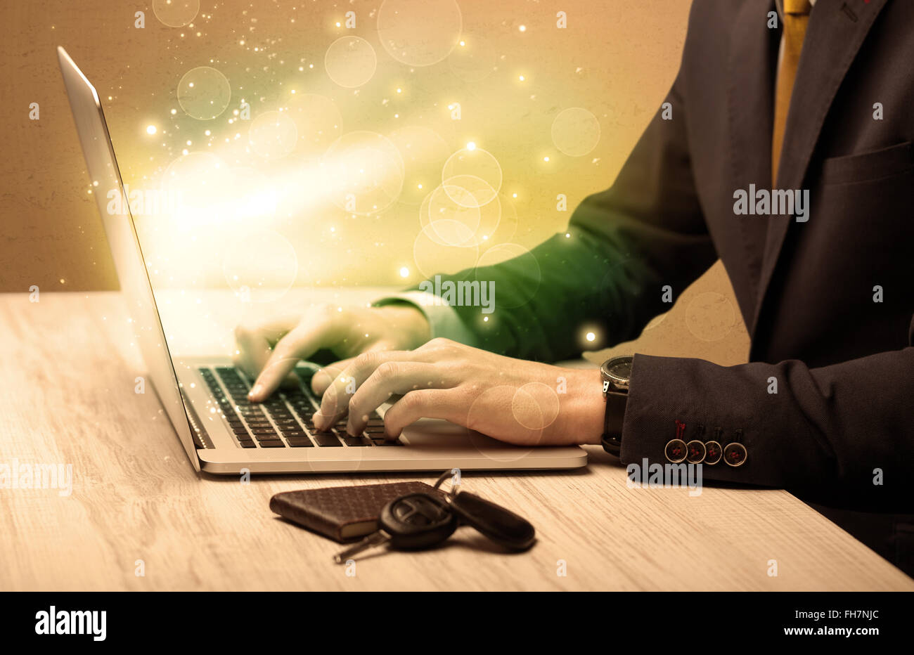 Businessman working fast on laptop Stock Photo - Alamy