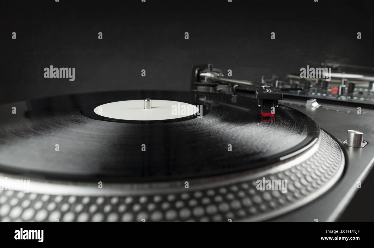 Turntable playing vinyl close up with needle on the record Stock Photo ...