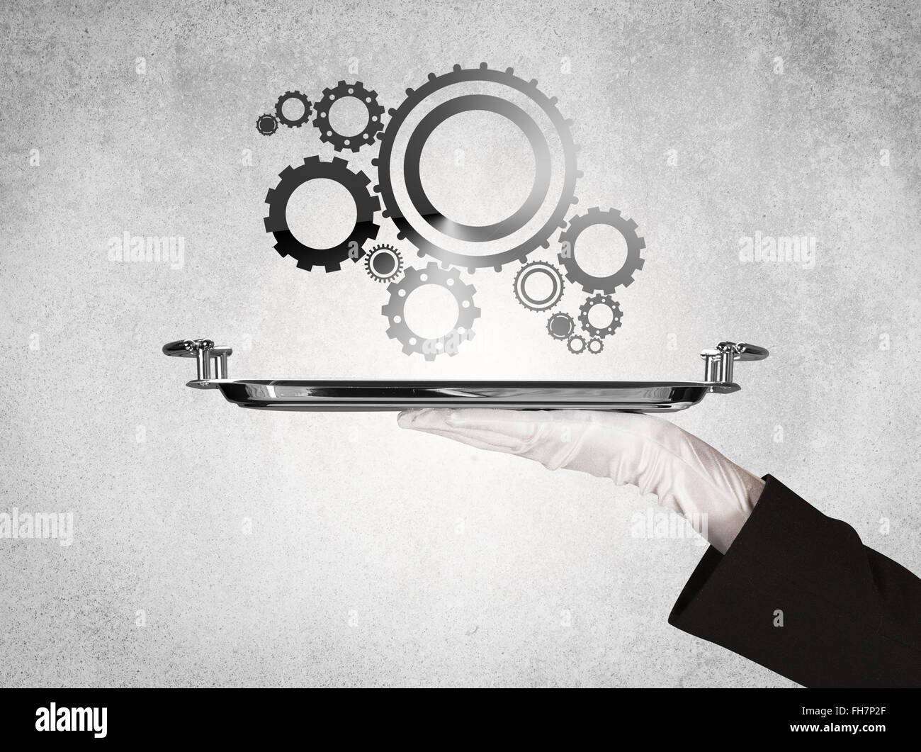 Working cog wheel concept on tray Stock Photo - Alamy