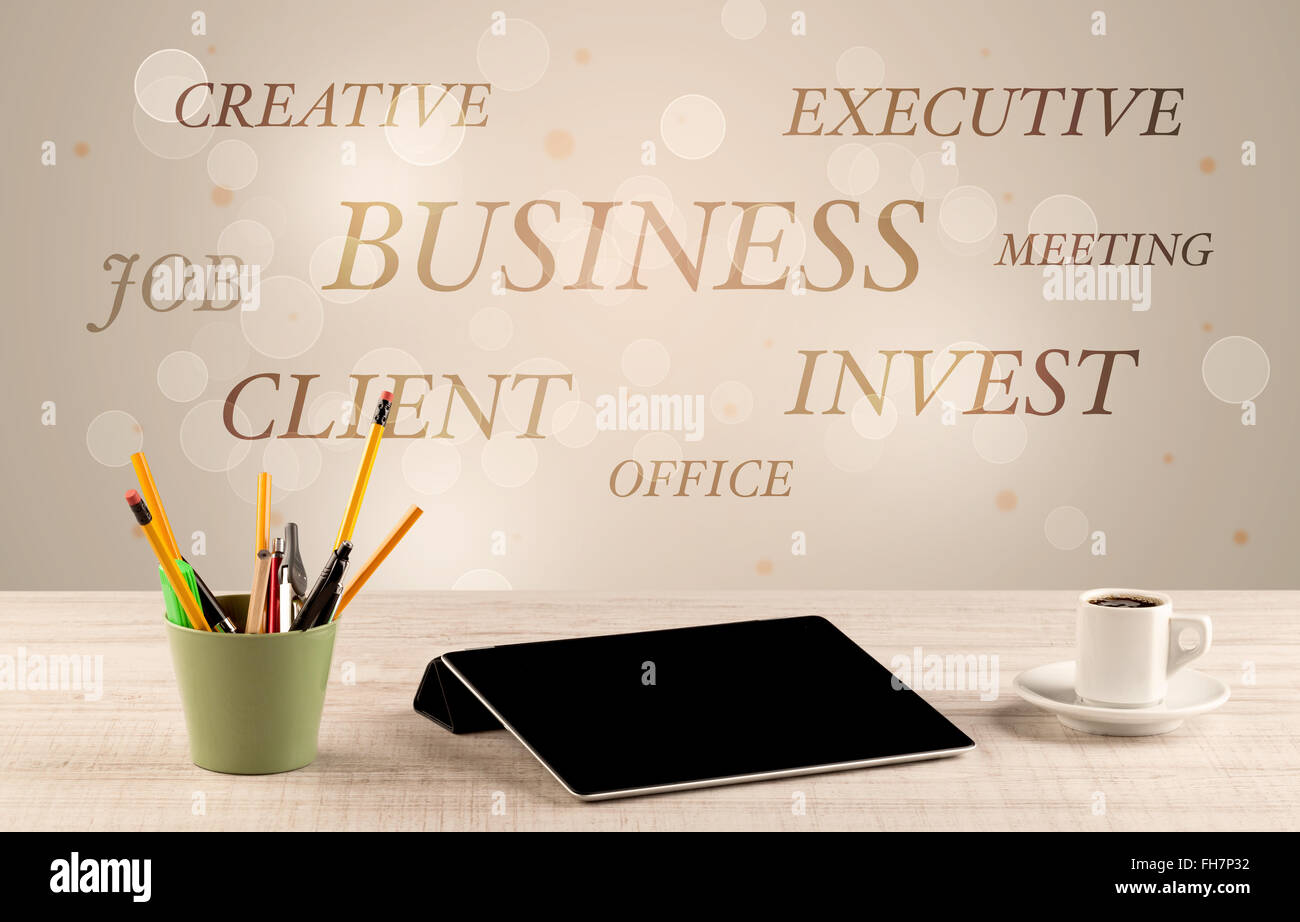 Business office desk with writing on wall Stock Photo - Alamy