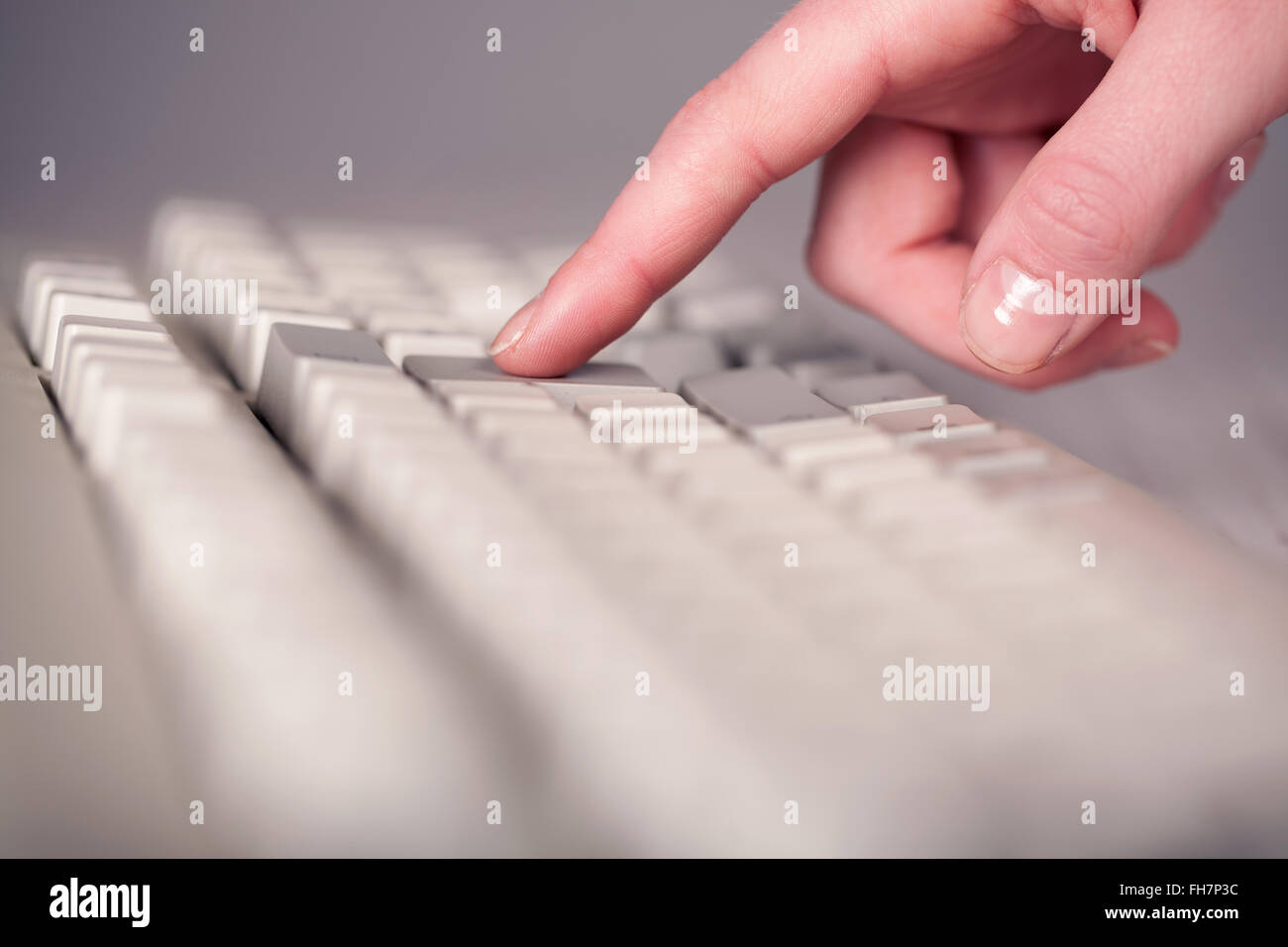 Close up of hand pressing keyboard buttons Stock Photo - Alamy