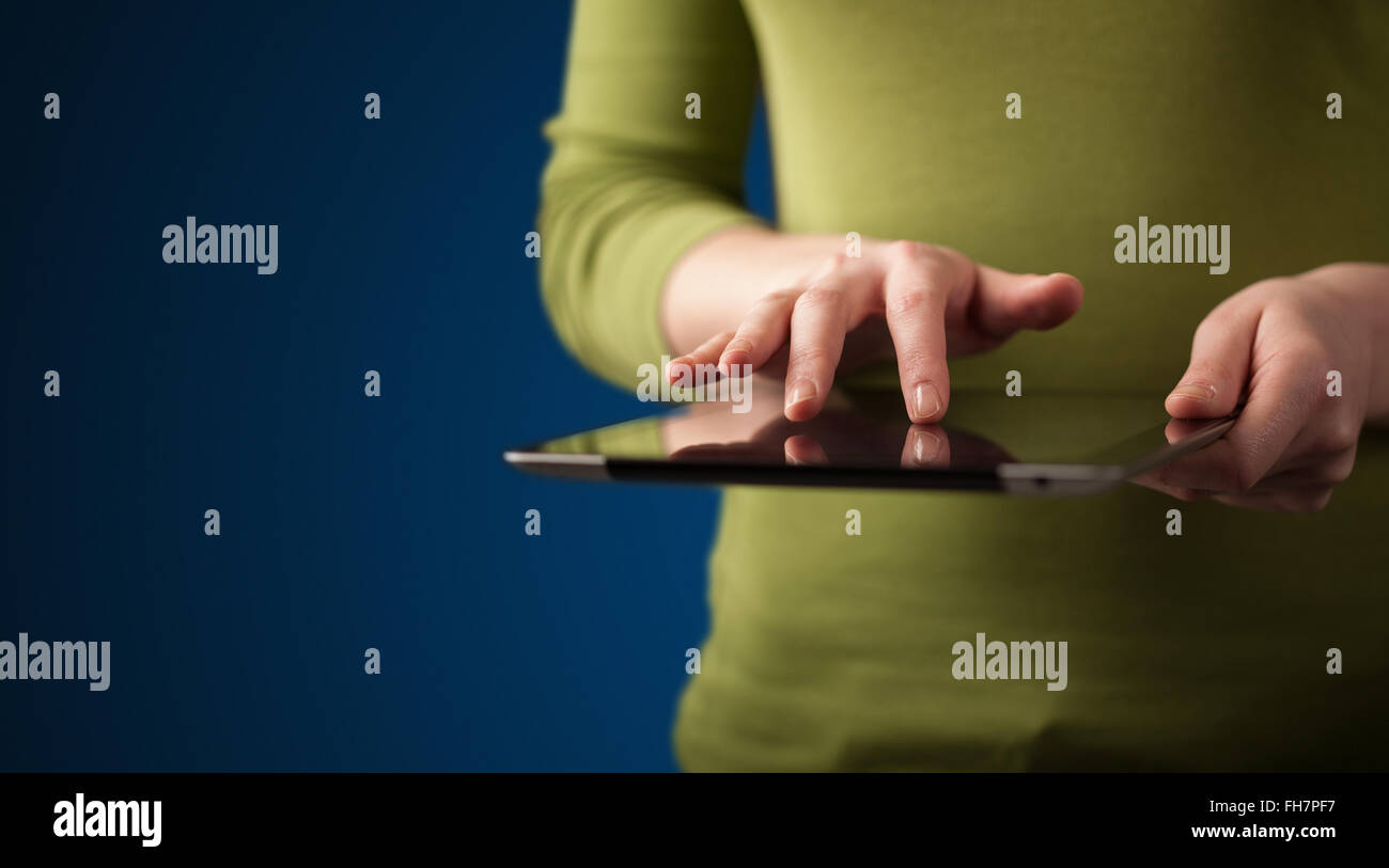 Close up of hand holding digital touchpad tablet device Stock Photo - Alamy