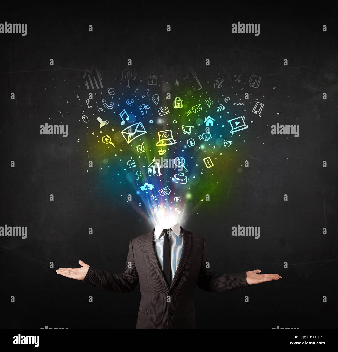 Business man with glowing media icons exploding head Stock Photo - Alamy