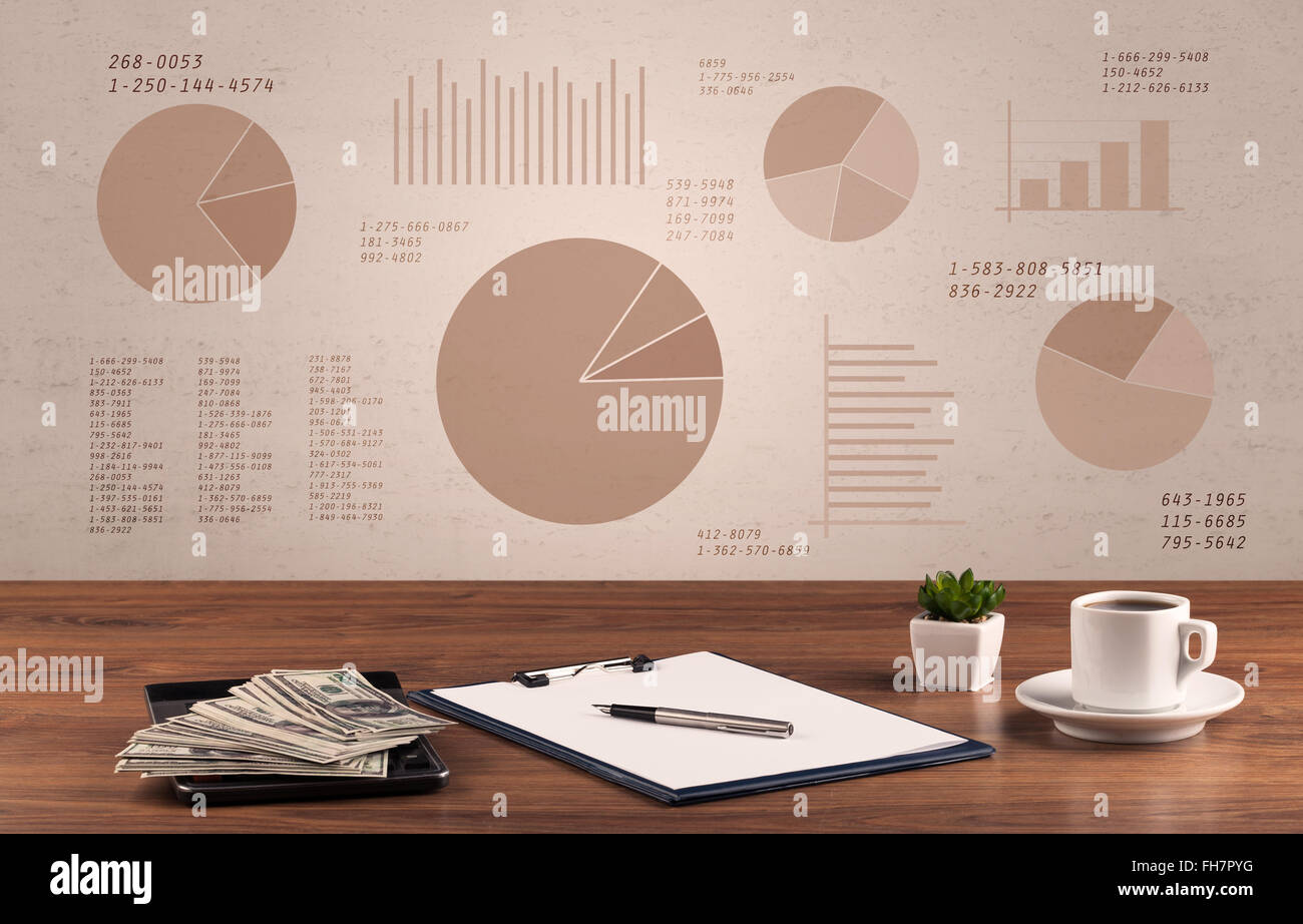 Pie chart graph office desk Stock Photo - Alamy