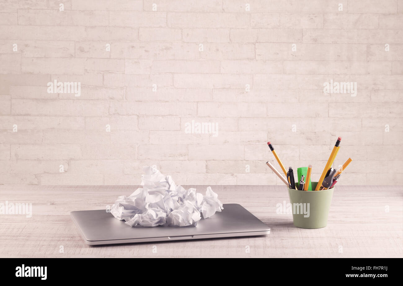 Office desk closeup with white brick wall Stock Photo - Alamy