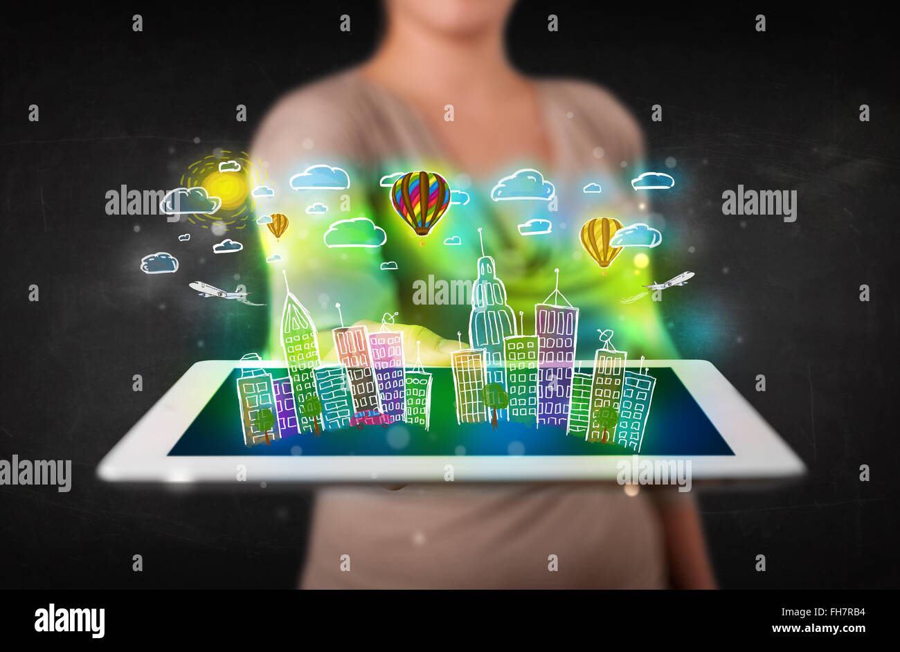 Young person showing tablet with hand drawn cityscape Stock Photo - Alamy