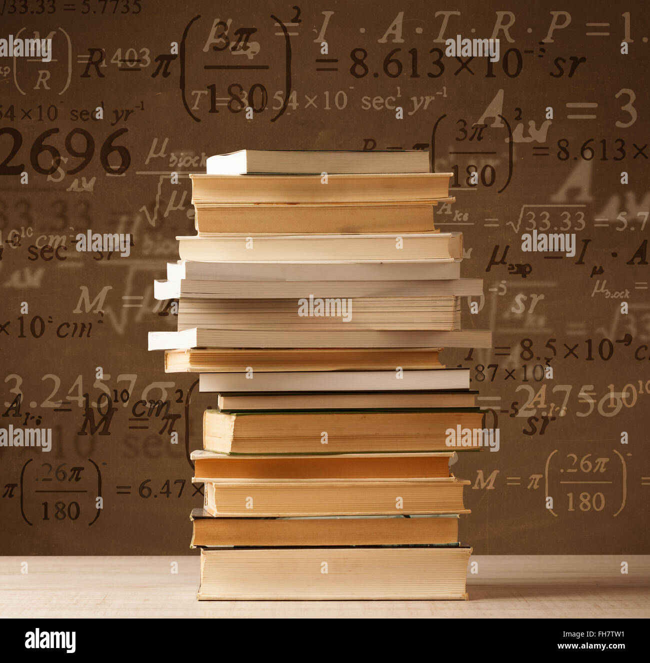 Books on vintage background with math formulas Stock Photo - Alamy