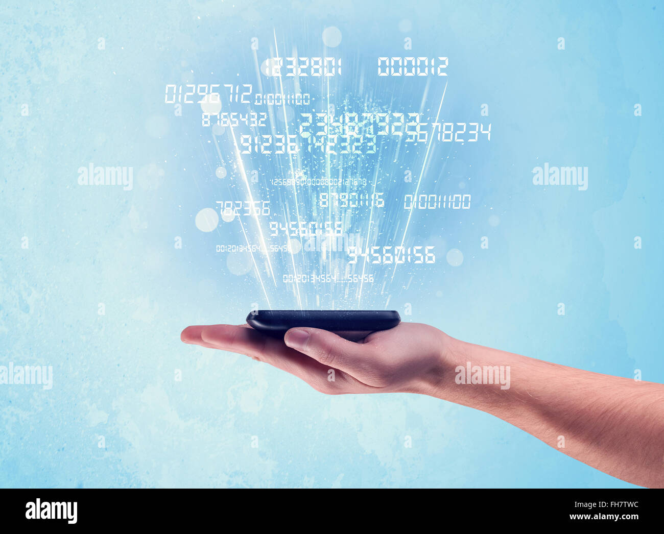 Hand holding phone with digital numbers Stock Photo - Alamy