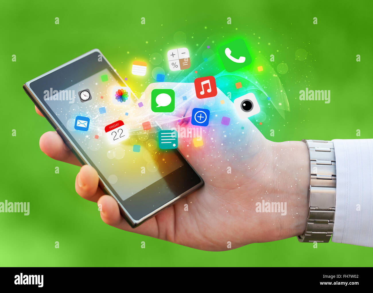 Hand holding smartphone with colorful app icons Stock Photo - Alamy