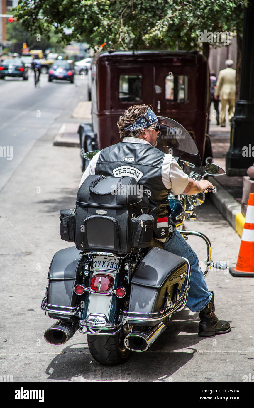 A biker sits on 6th Street in Austin during the ROT Rally Stock Photo ...