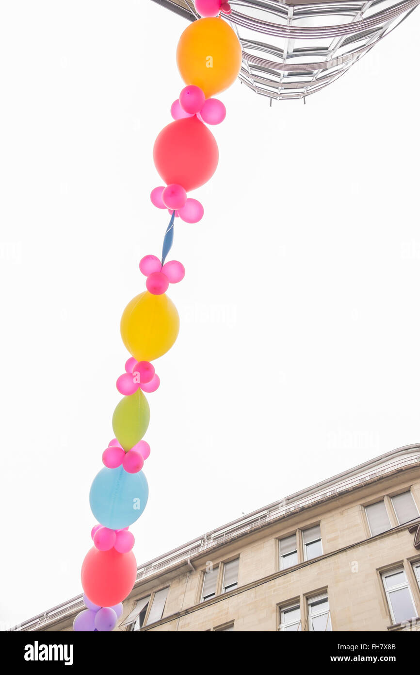 balloons on string, partial view of residential building Stock Photo ...