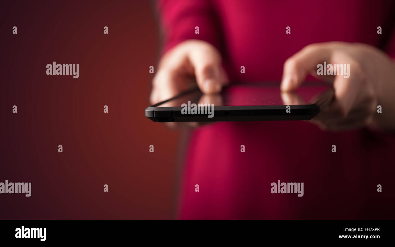 Close up of hand holding digital touchpad tablet device Stock Photo - Alamy