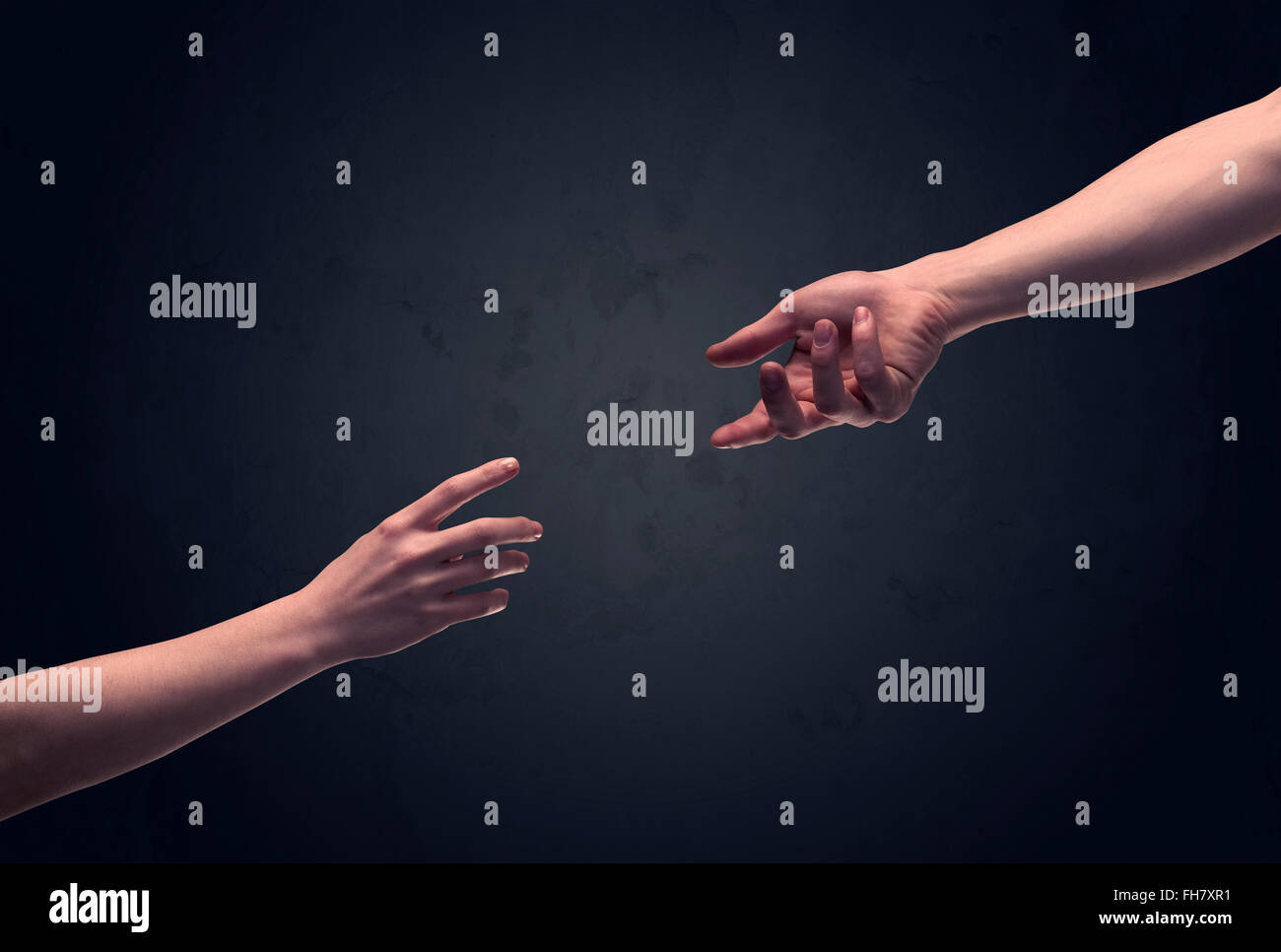 Hand about to touch another one Stock Photo - Alamy
