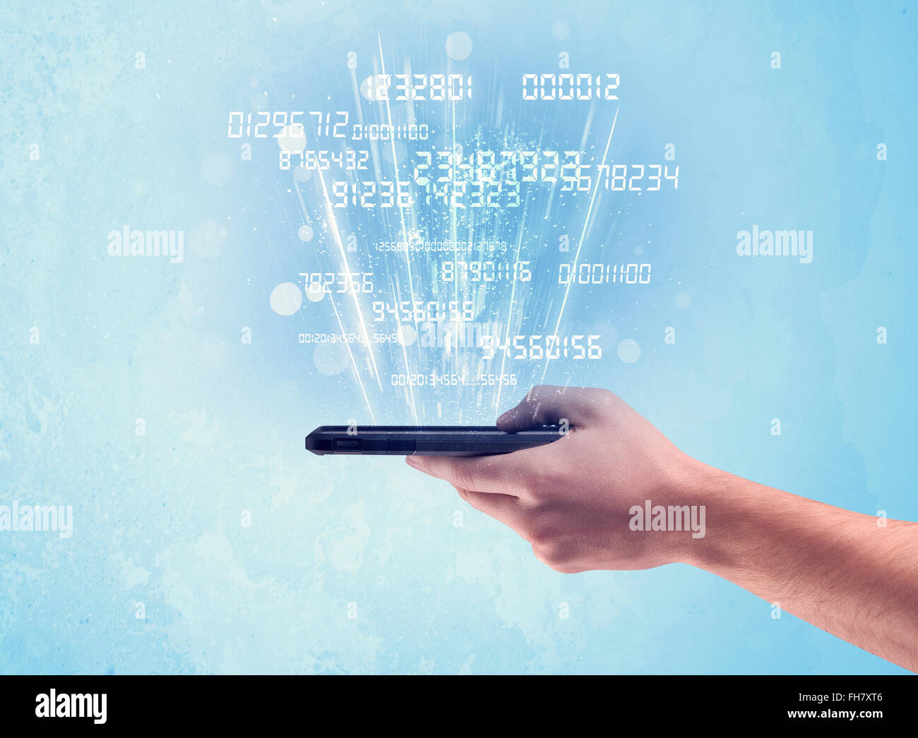 Hand holding phone with digital numbers Stock Photo - Alamy