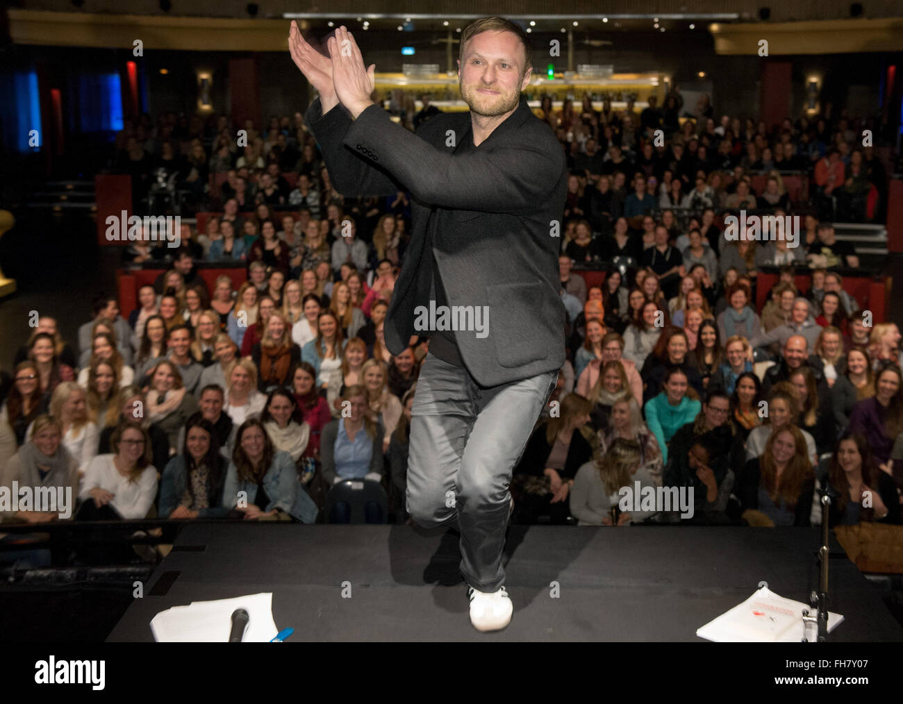 Author Michael Nast poses for a selfie with the audience following a ...