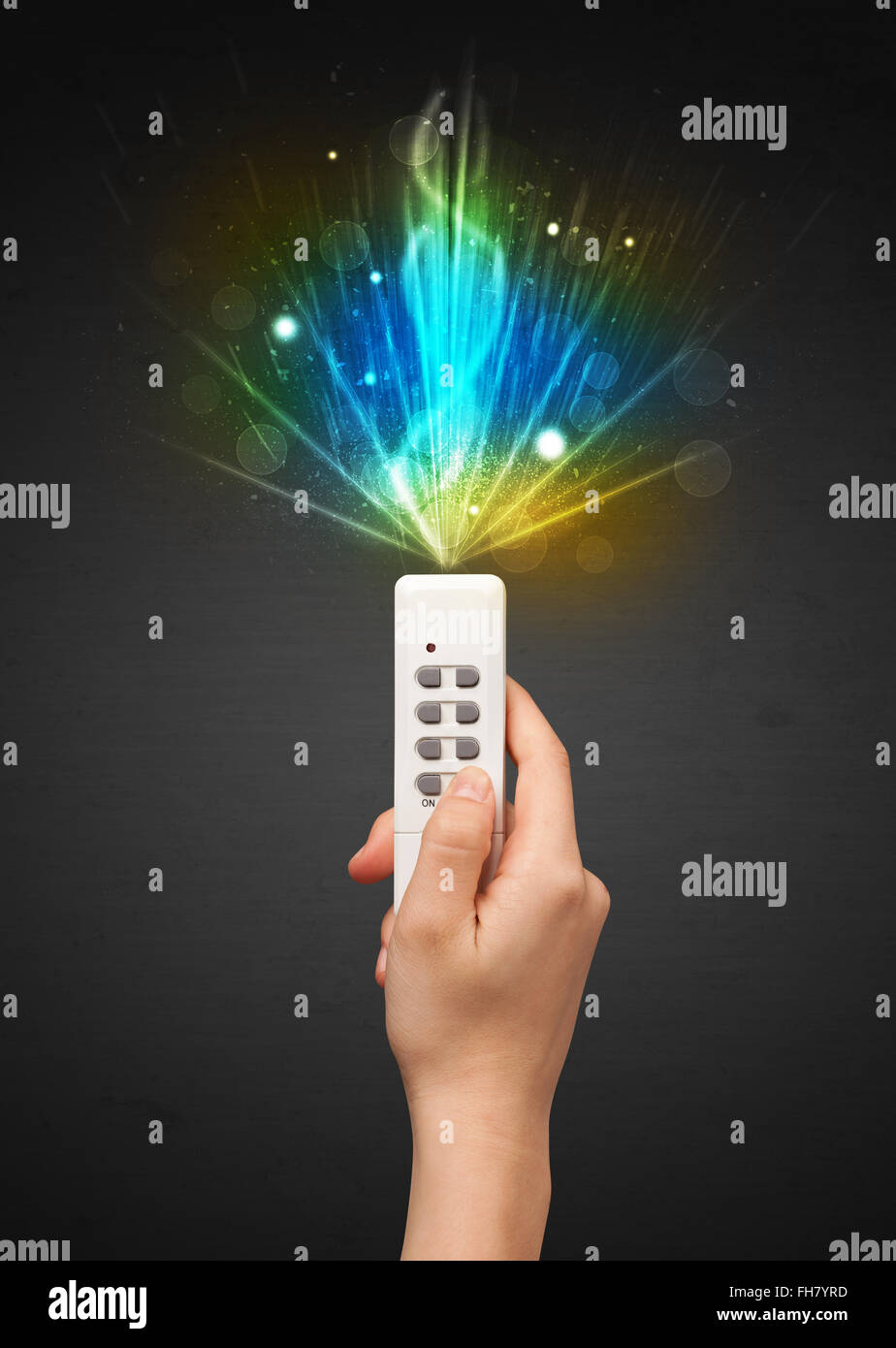 Hand with remote control and explosive signal Stock Photo - Alamy