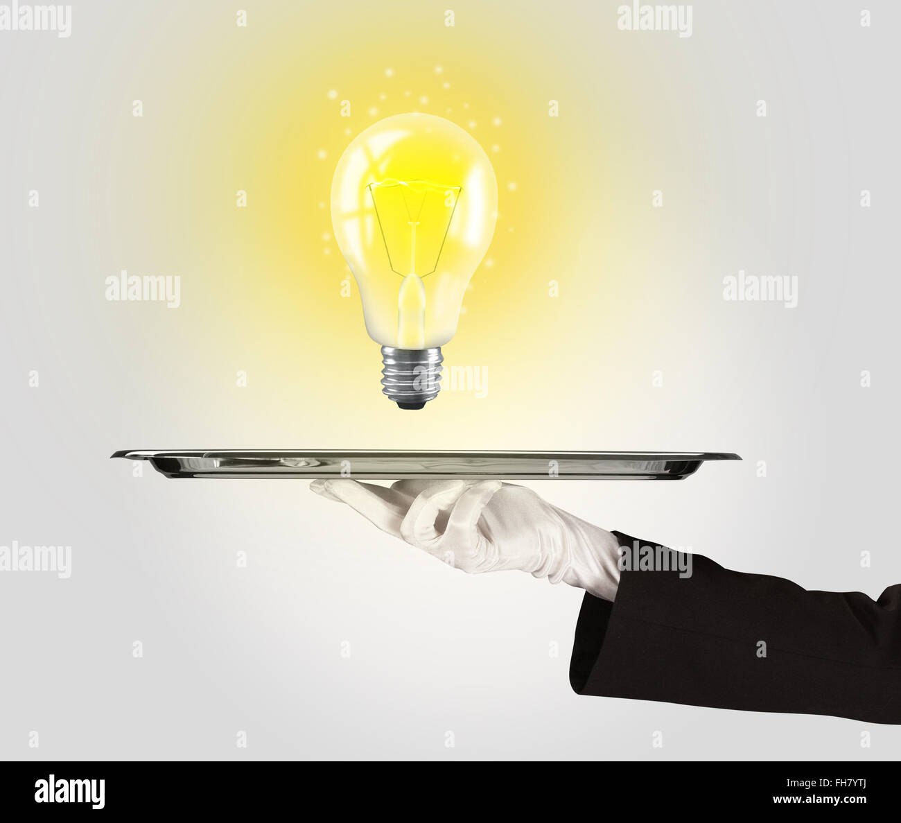 Clever idea concept with bulb on tray Stock Photo - Alamy