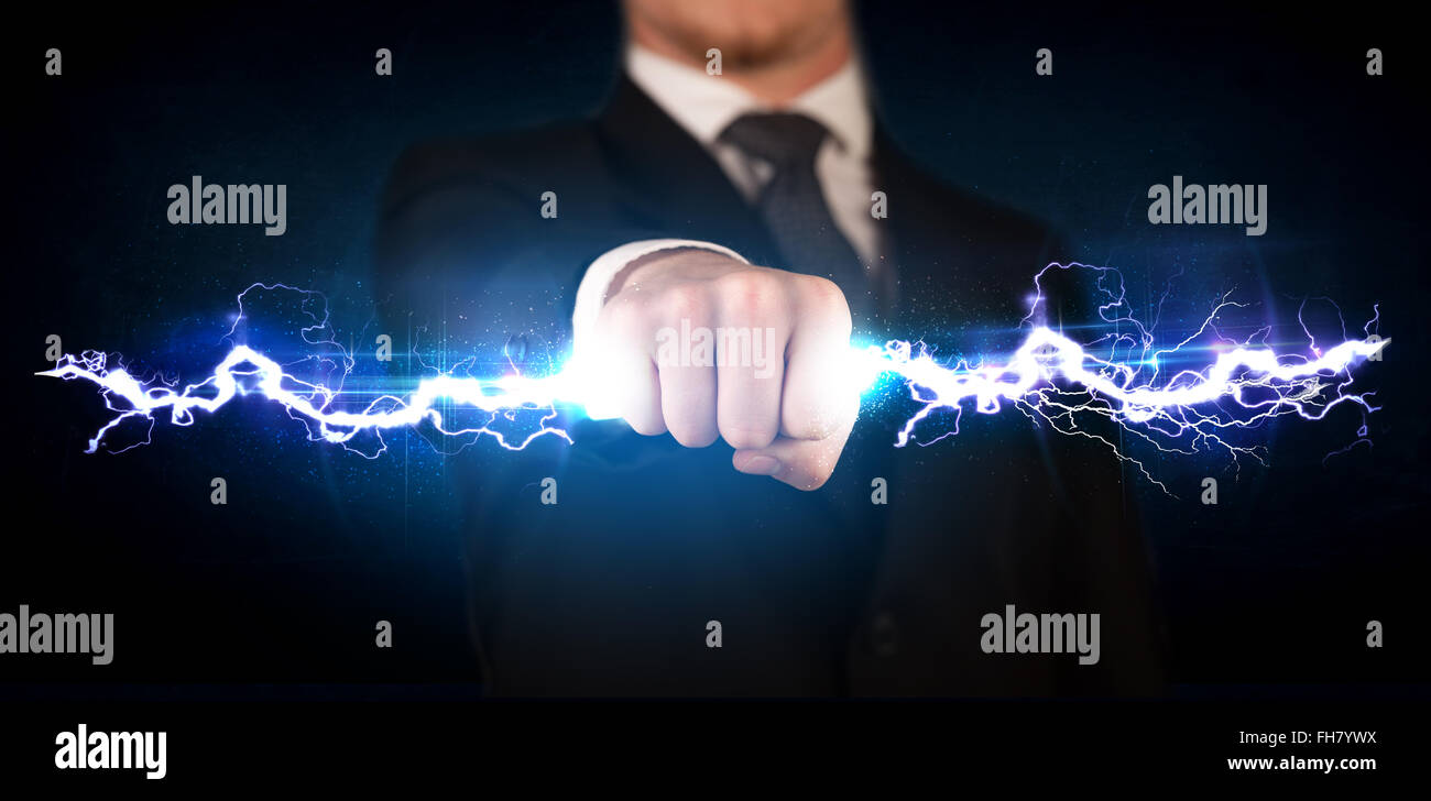 Business man holding electricity light bolt in his hands Stock Photo ...
