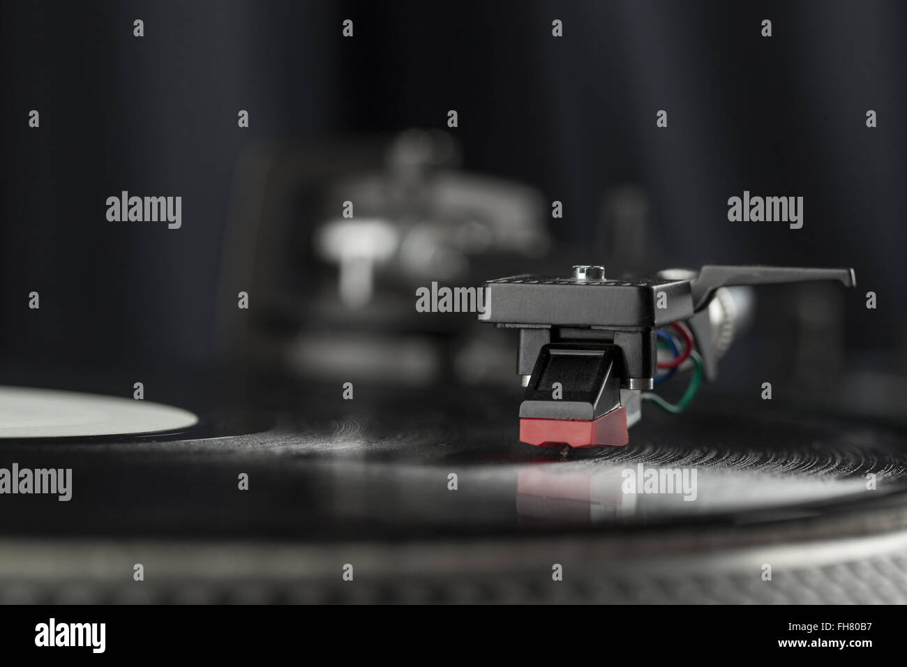 Turntable playing vinyl close up with needle on the record Stock Photo ...