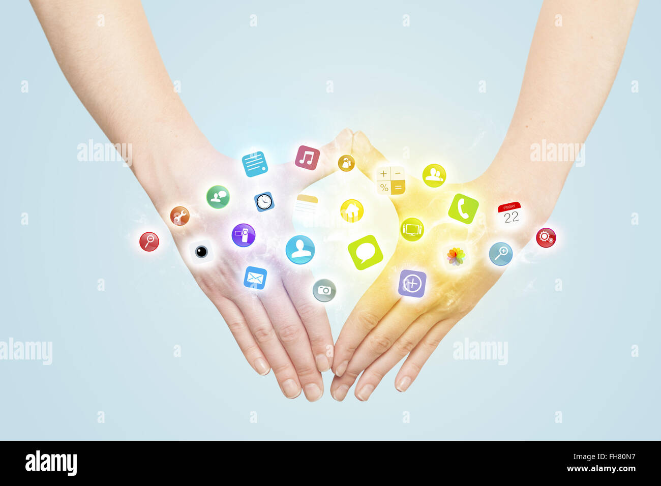 Hands creating a form with mobile app icons Stock Photo - Alamy