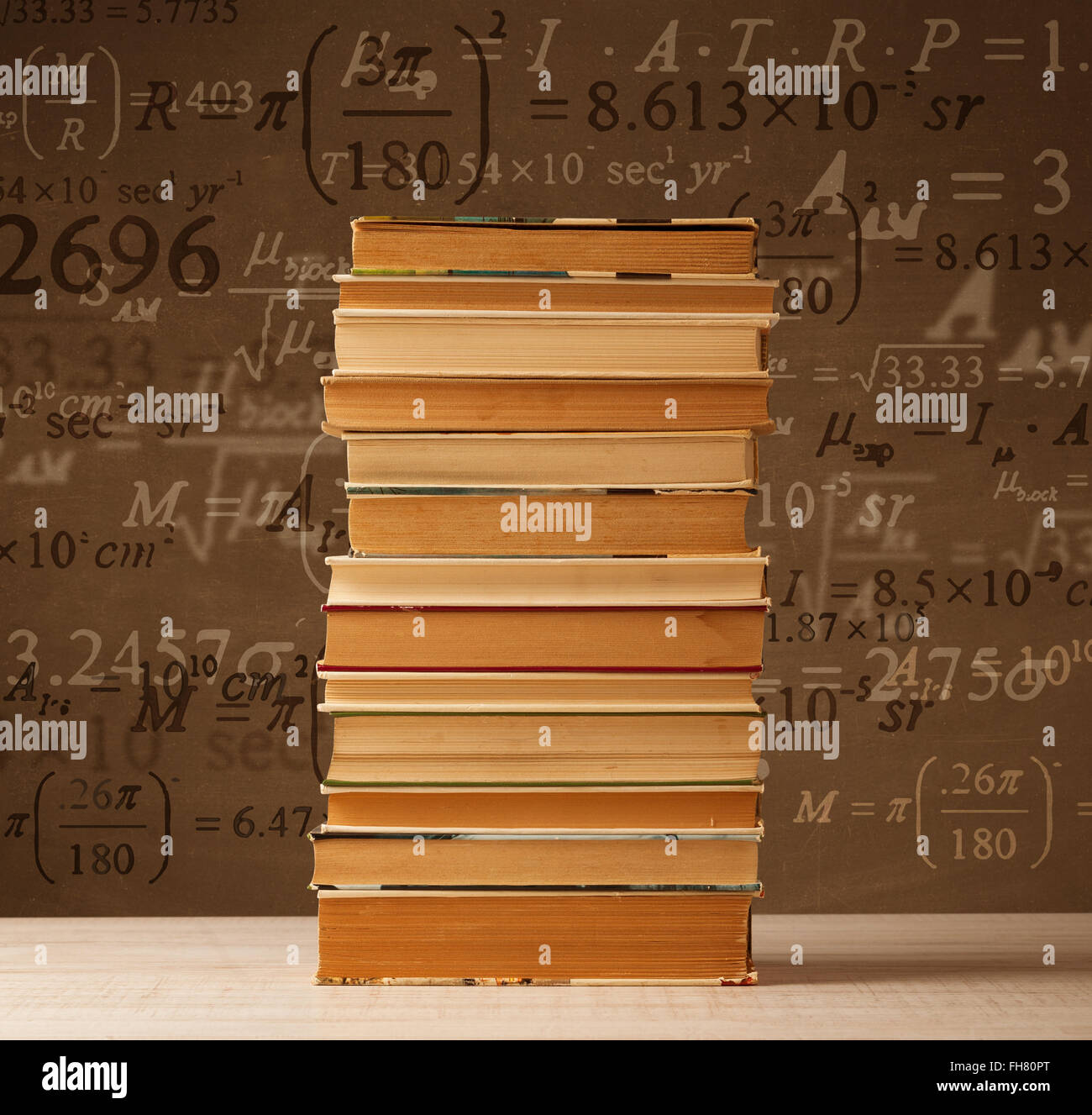 Books on vintage background with math formulas Stock Photo - Alamy