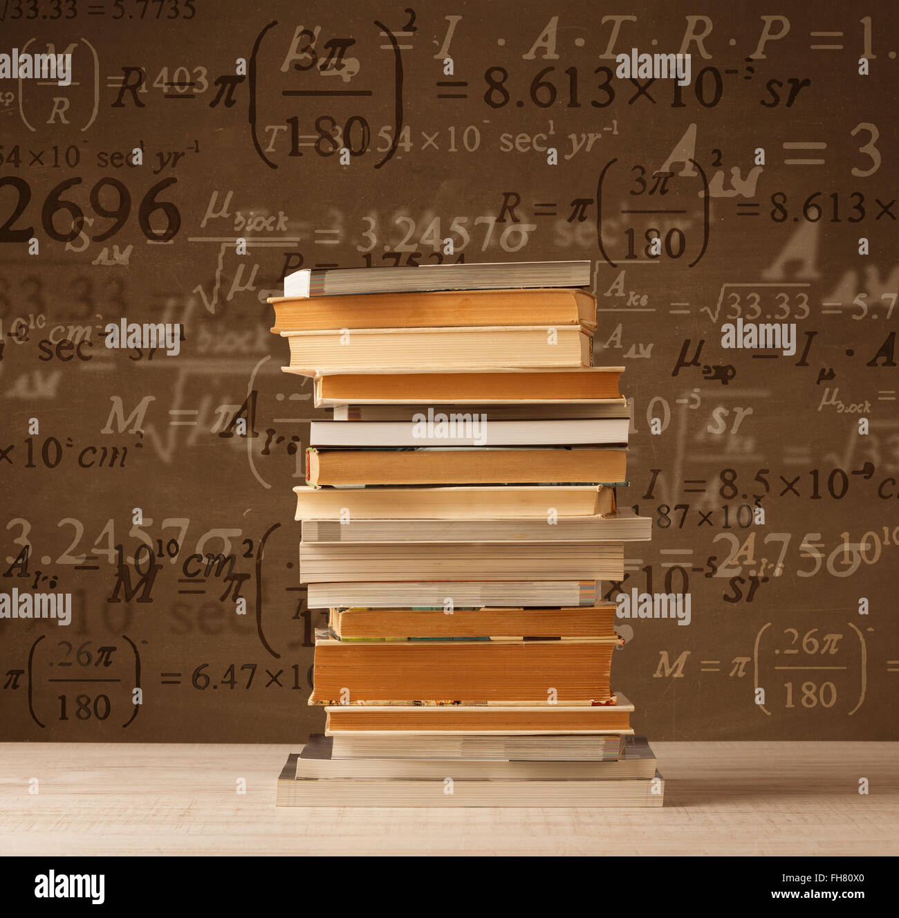 Books on vintage background with math formulas Stock Photo - Alamy