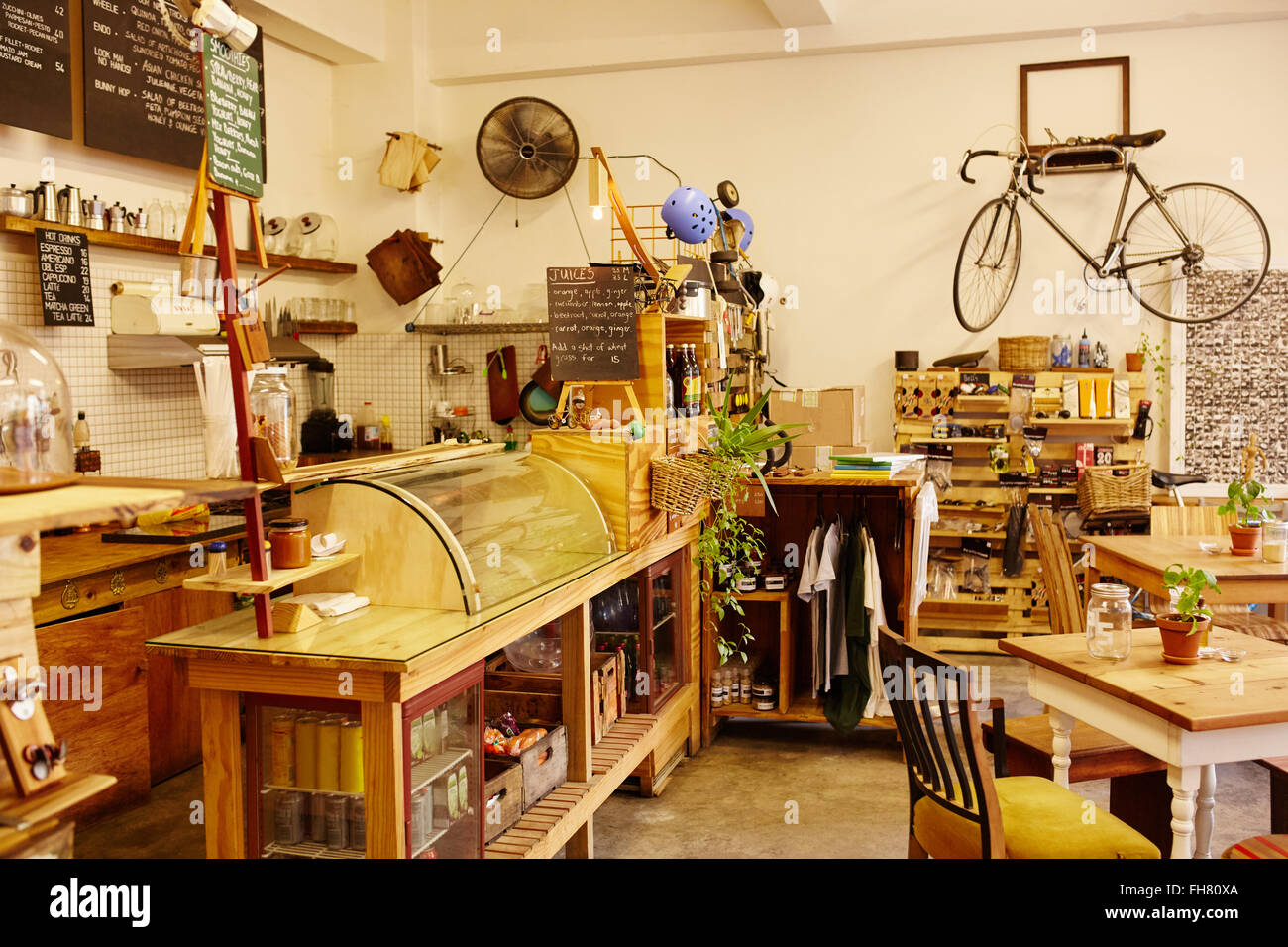 Shot of the counter in a trendy coffee shop with bicycls hanging on the ...