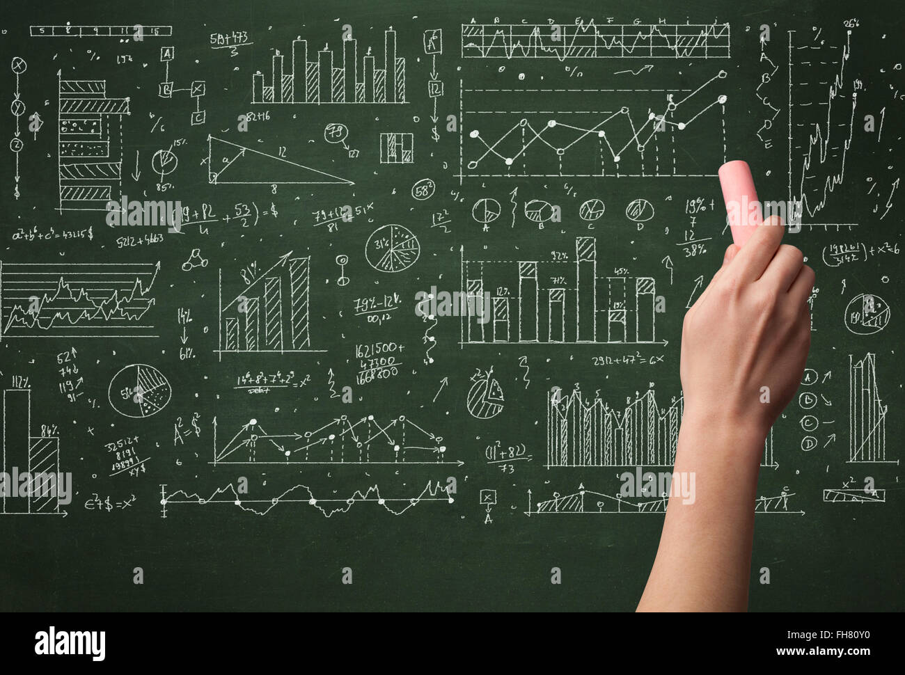 A business person drawing data on chalkboard Stock Photo - Alamy