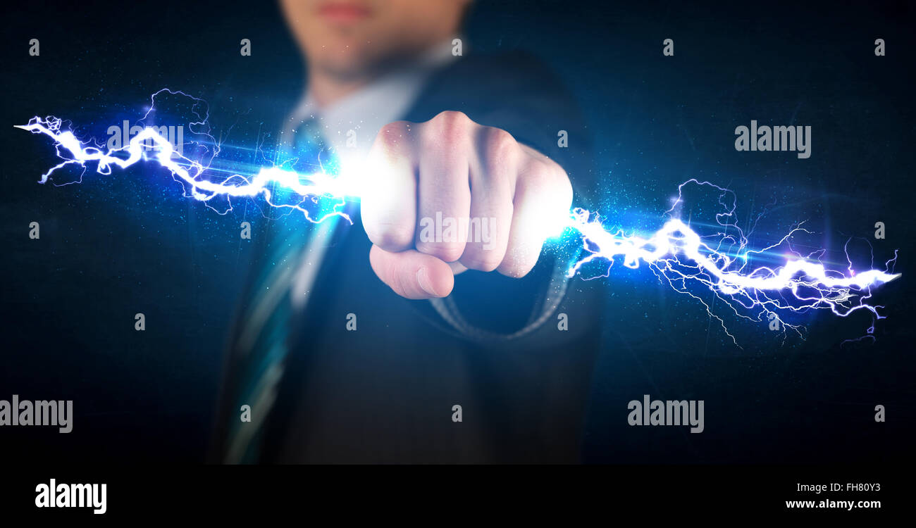 Business man holding electricity light bolt in his hands Stock Photo ...