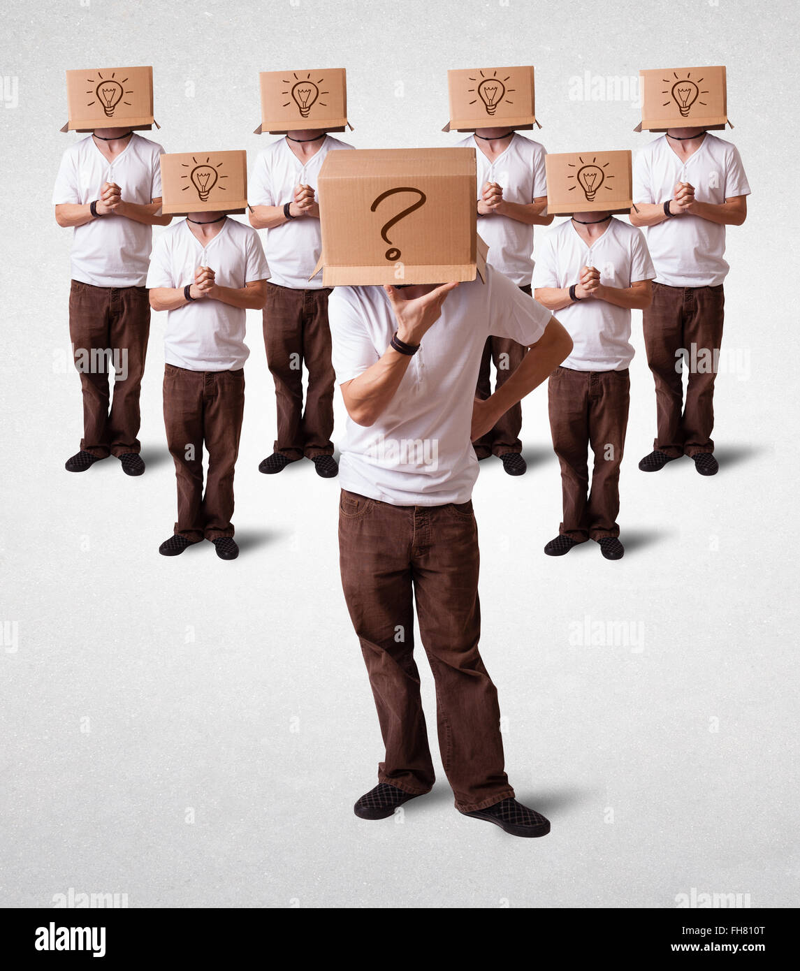 Handsome men in suit gesturing with drawn question marks on box Stock ...