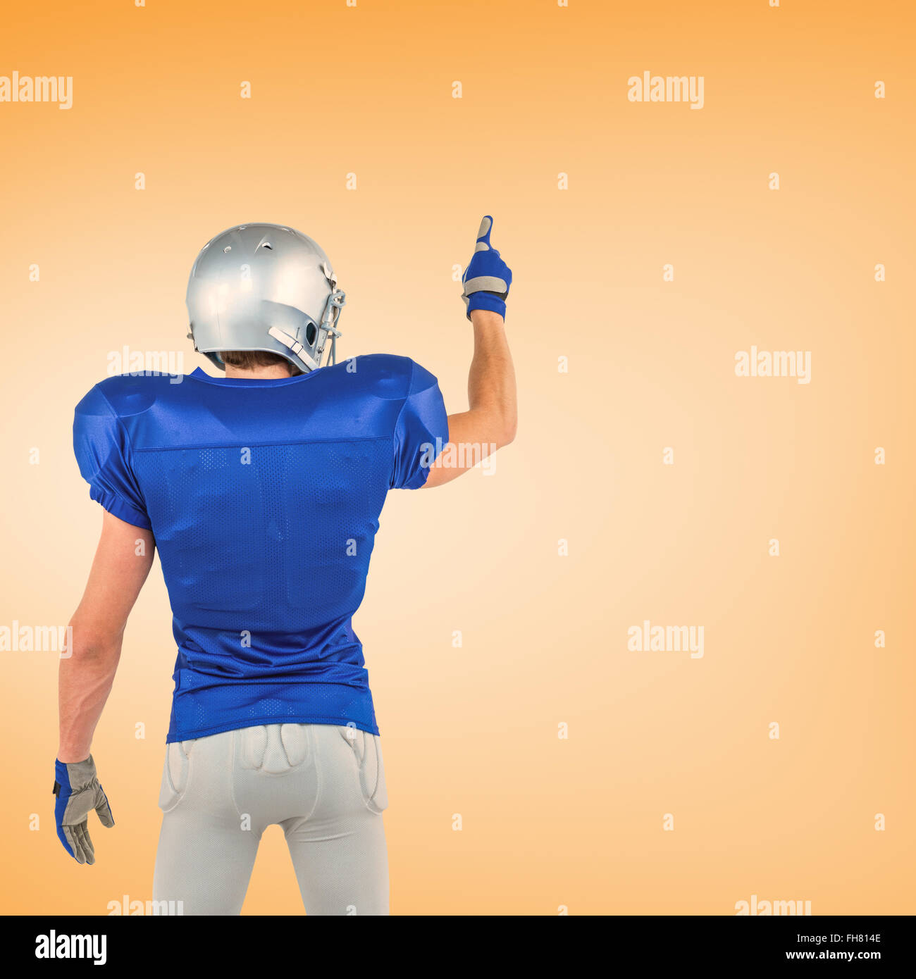 Composite image of rear view of sports player pointing Stock Photo - Alamy