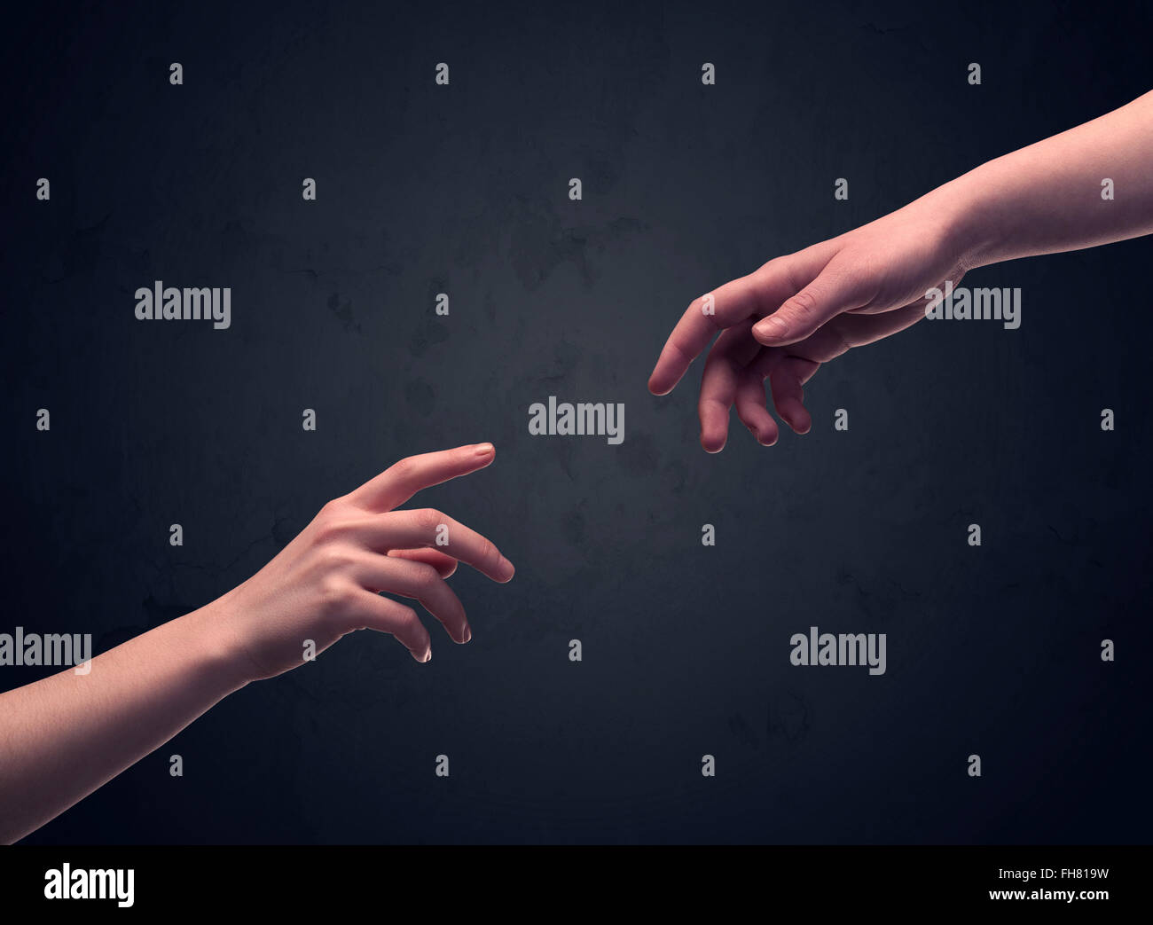 Hand about to touch another one Stock Photo - Alamy