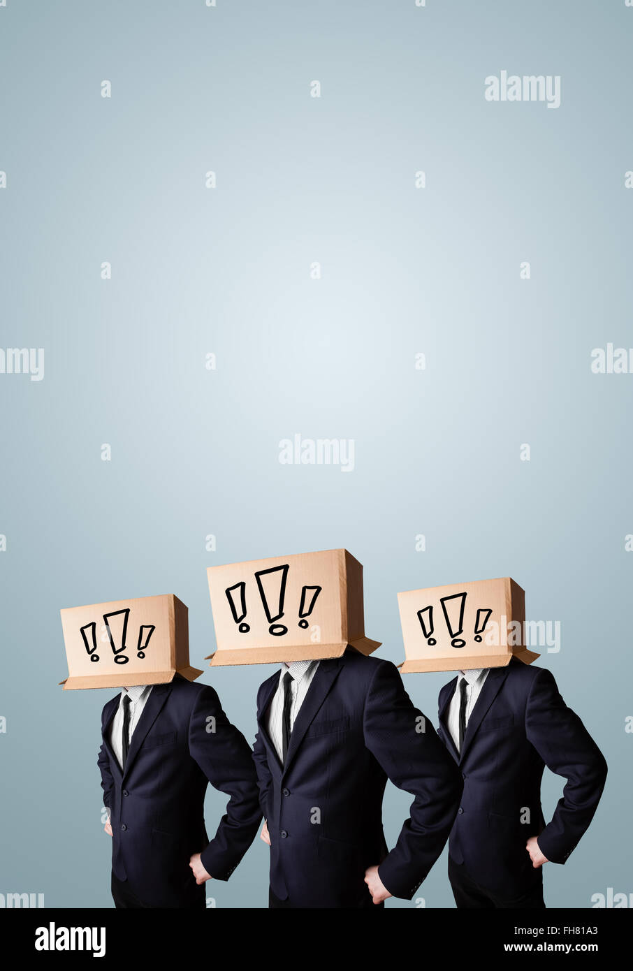 Men gesturing with exclamation marks on box on their head Stock Photo ...