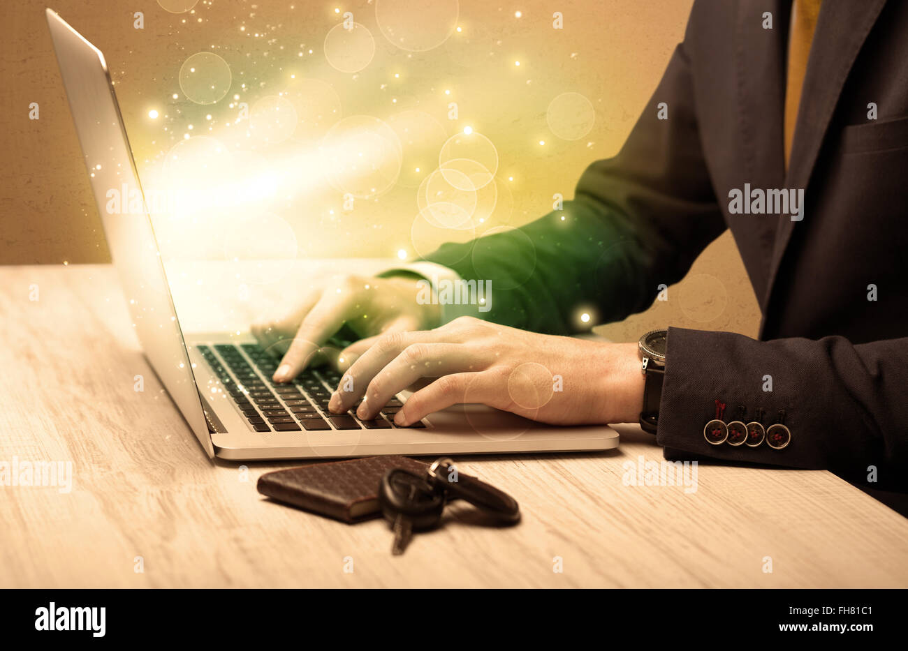 Businessman working fast on laptop Stock Photo - Alamy