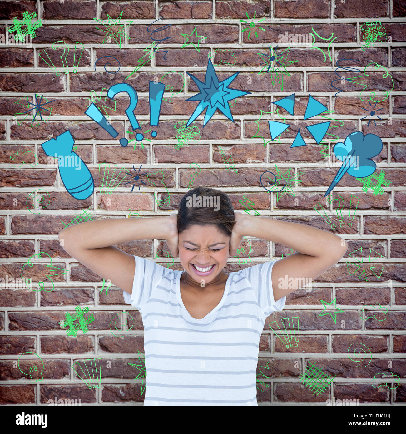 Composite image of angry woman covering ears Stock Photo - Alamy