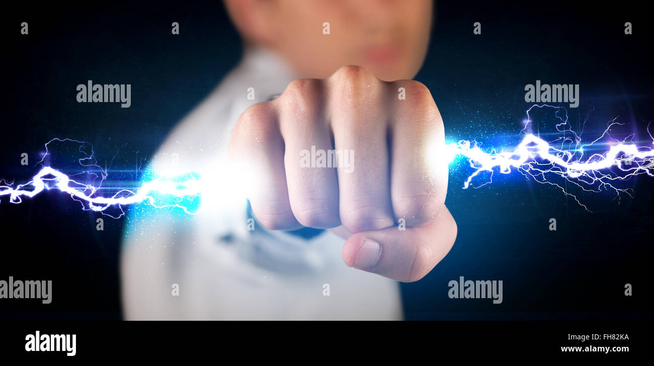 Business man holding electricity light bolt in his hands Stock Photo ...