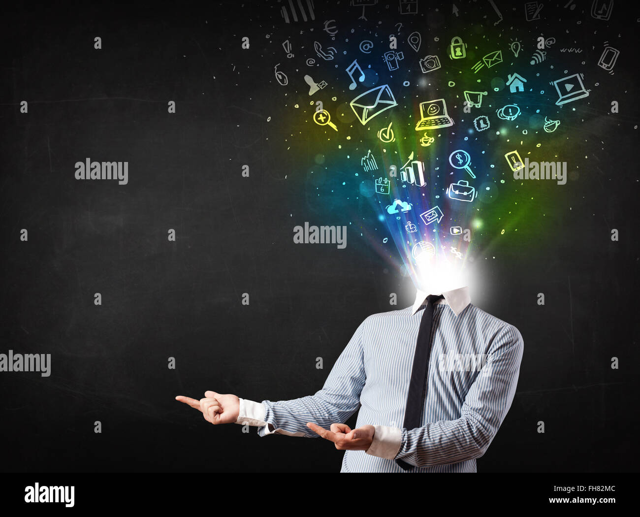 Business man with glowing media icons exploding head Stock Photo - Alamy