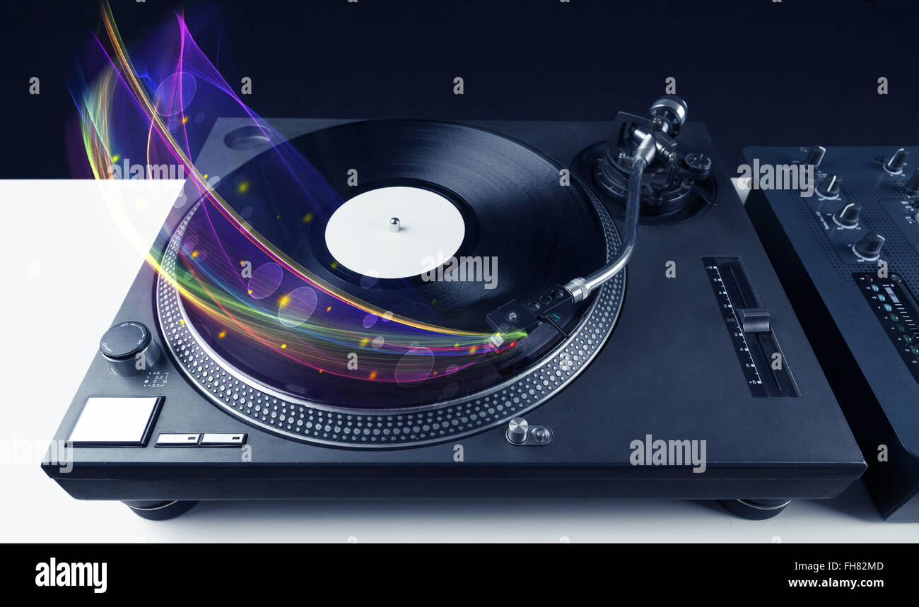Turntable playing vinyl with glowing abstract lines Stock Photo - Alamy